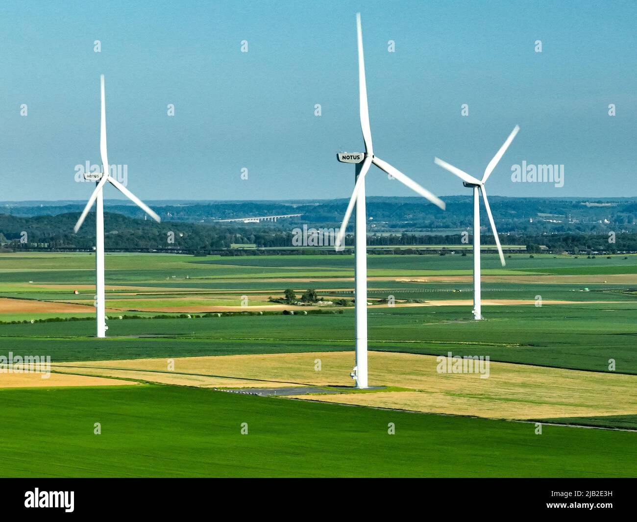 Wind farm and wind turbines under a blue sky Stock Photo - Alamy