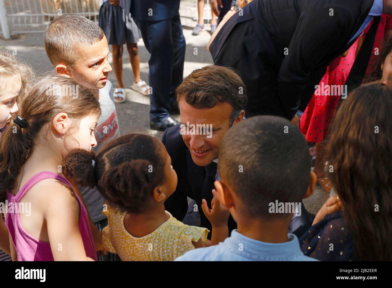 French President Emmanuel Macron during a visit to the Menpenti school ...