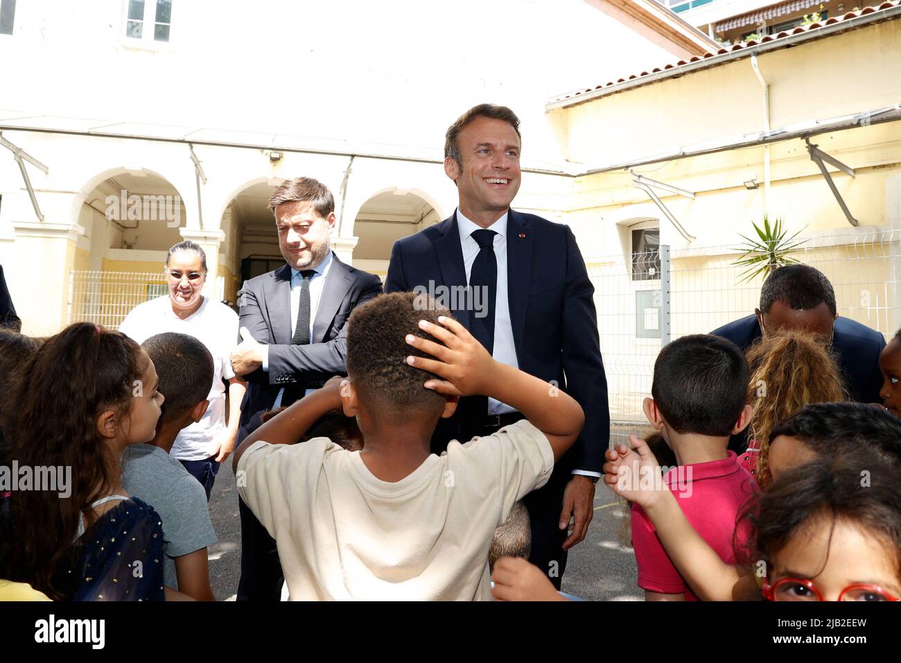 French President Emmanuel Macron during a visit to the Menpenti school ...