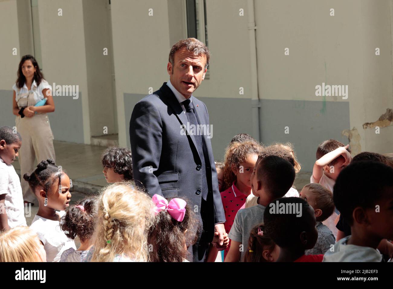 French President Emmanuel Macron during a visit to the Menpenti school ...