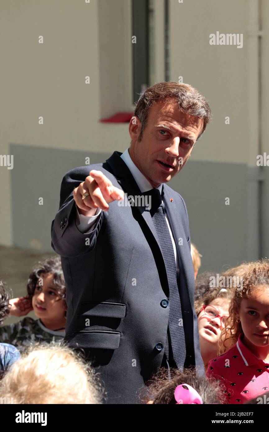 French President Emmanuel Macron during a visit to the Menpenti school ...