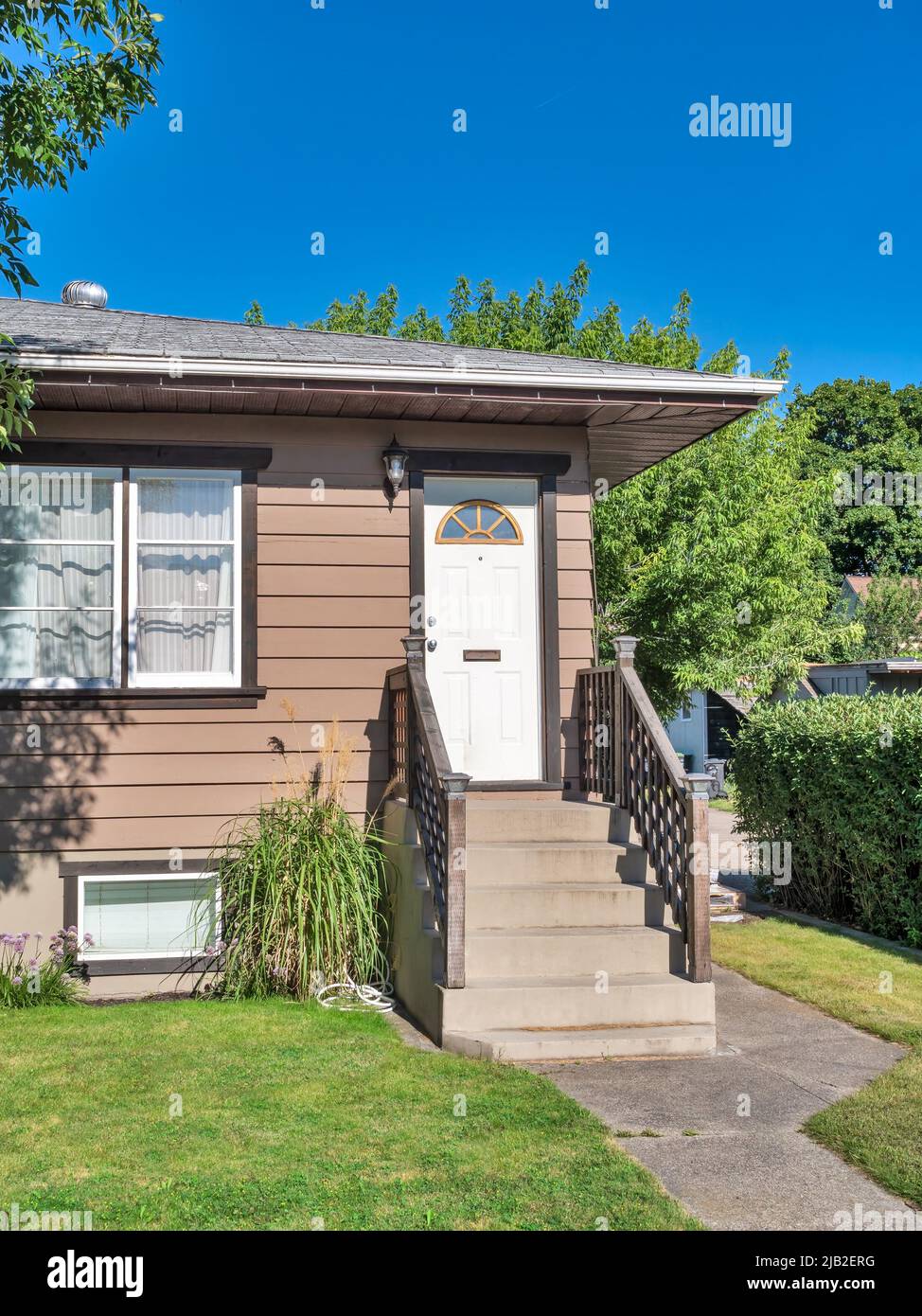 Entrance door of average residential house on bright sunny day Stock ...