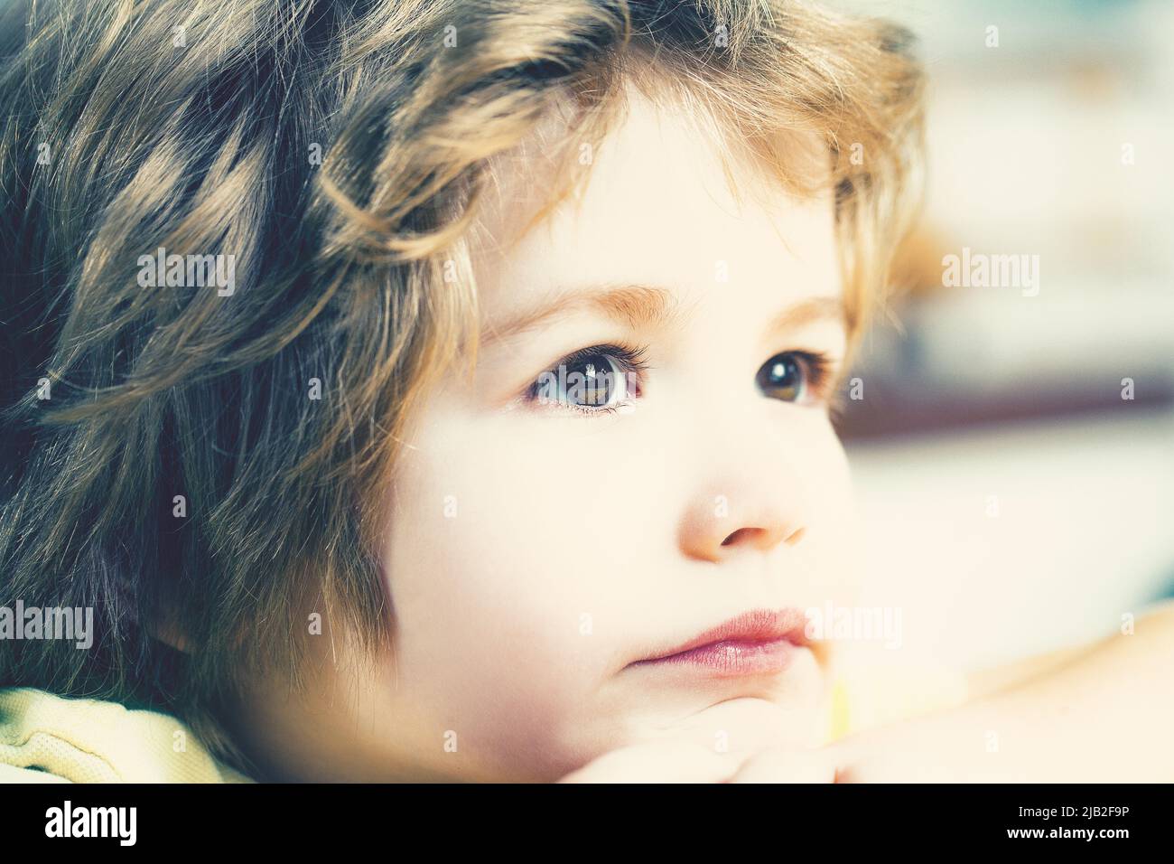 A close up of a young boy with a serious look of concern Stock Photo ...