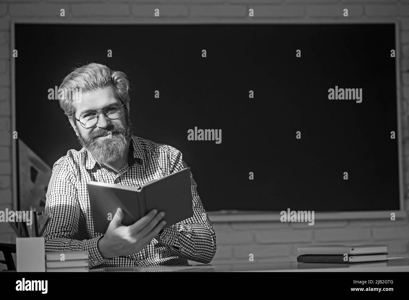 Student male reading book Black and White Stock Photos & Images - Alamy
