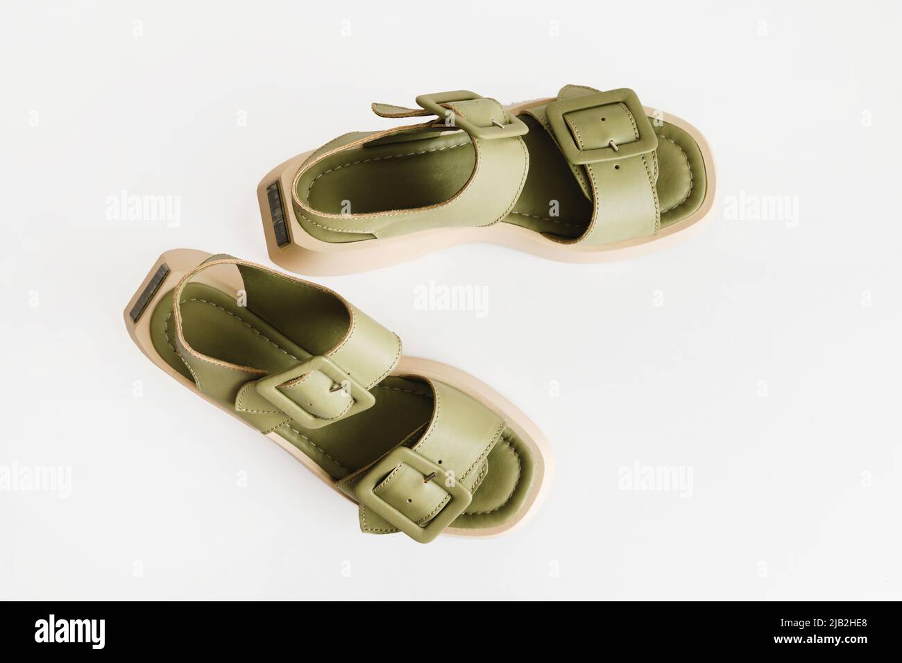 Leather women's platform sandals in olive color, top view isolate ...