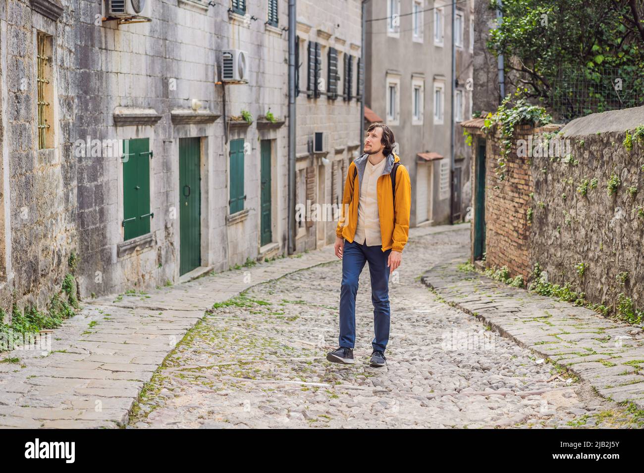 Man tourist on background of Scenic panorama view of the historic town ...