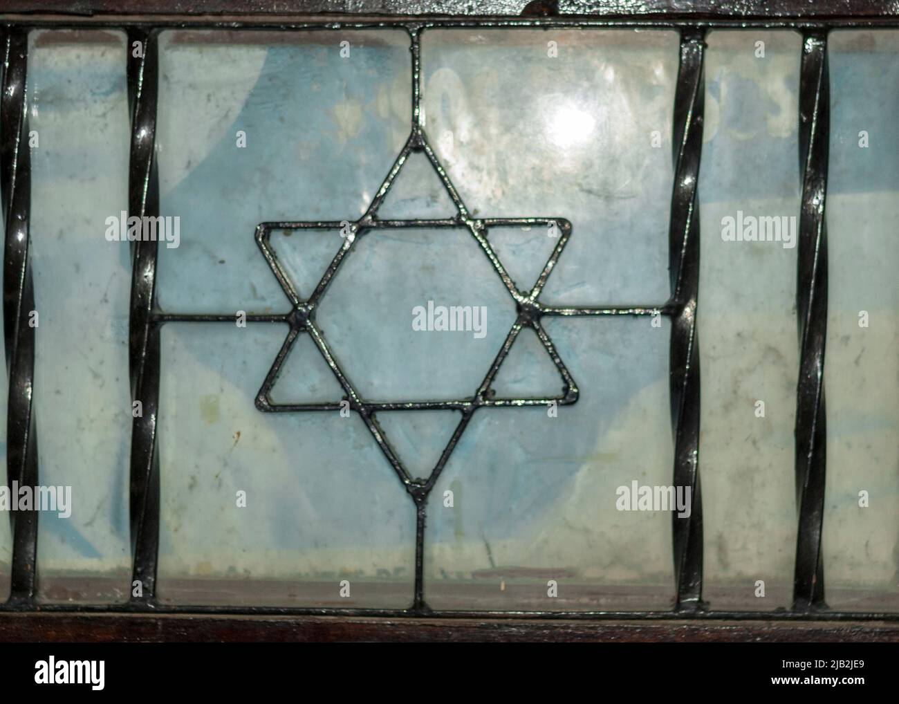 Star of David in wrought iron on wooden window with glass, Hervas Stock ...