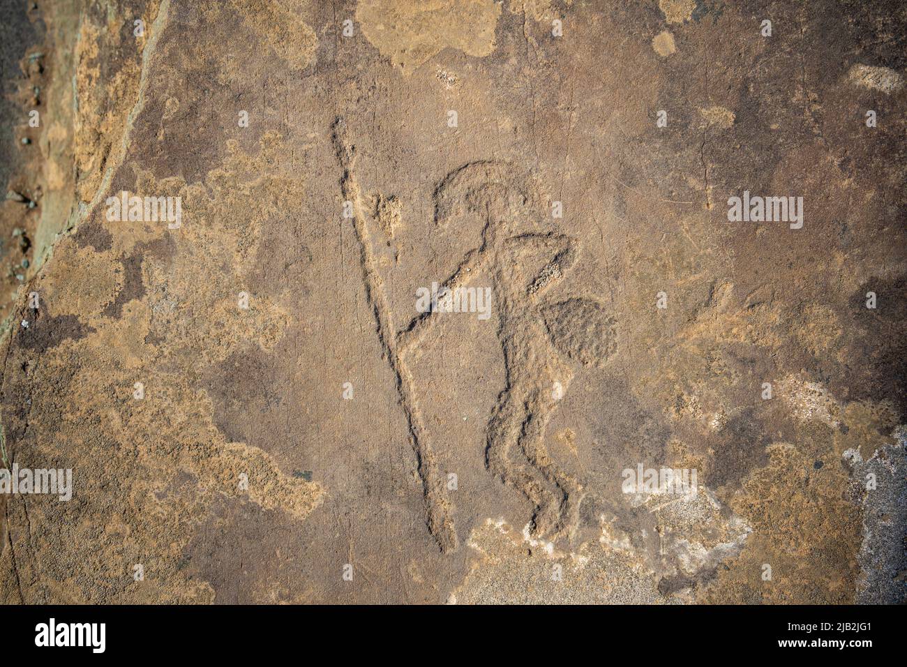 Drawn figures on the stone wall. Rock painting in mountain of Altai ...