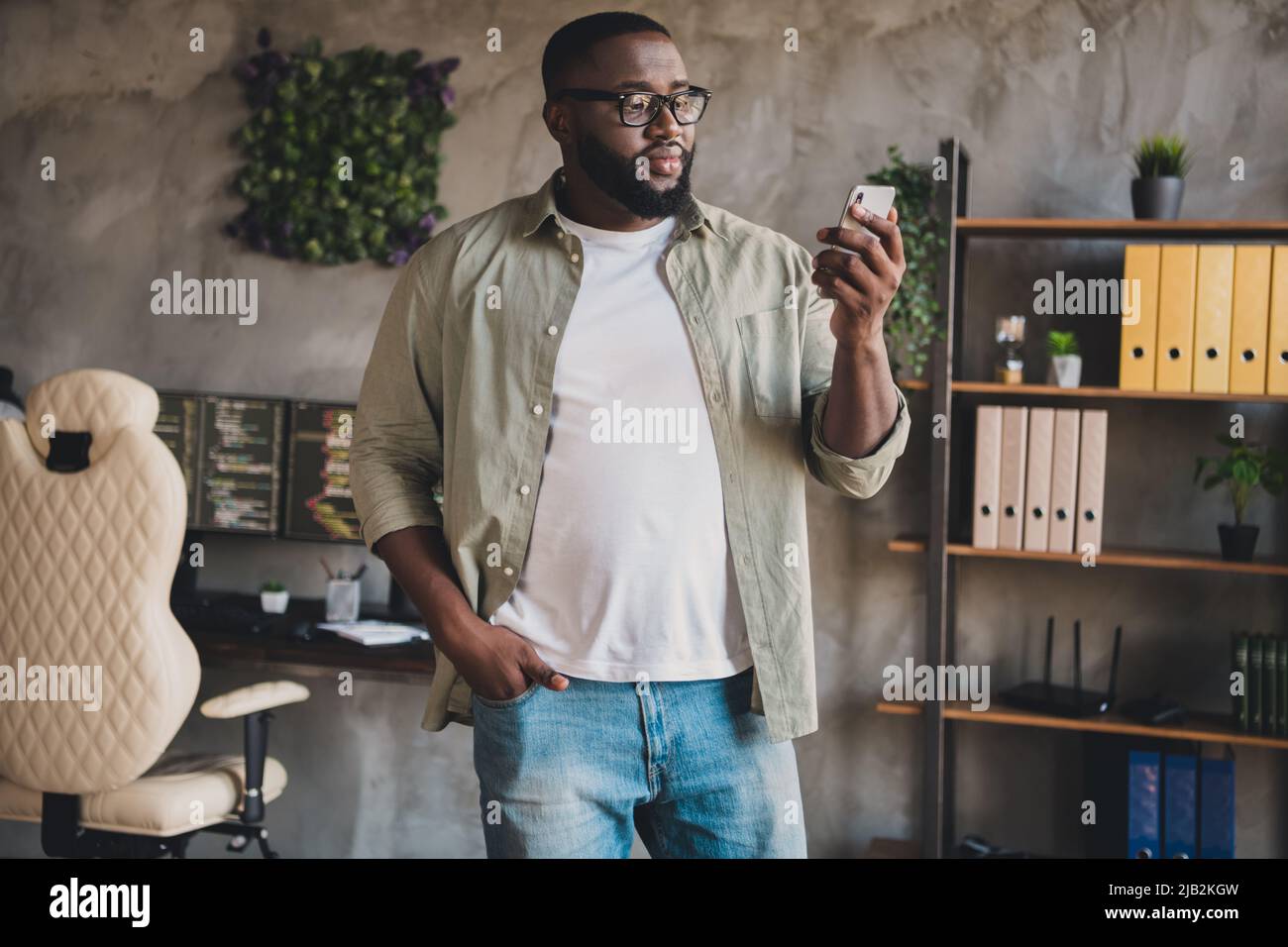 Portrait of attractive skilled intellectual focused guy tech company ...