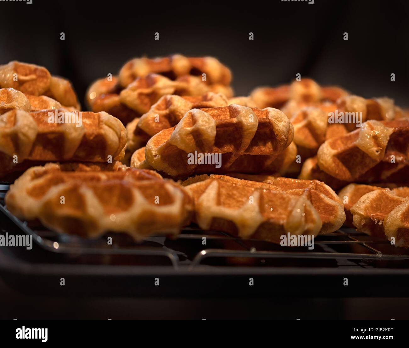 Fresh waffles on a market stall at a food market Stock Photo - Alamy