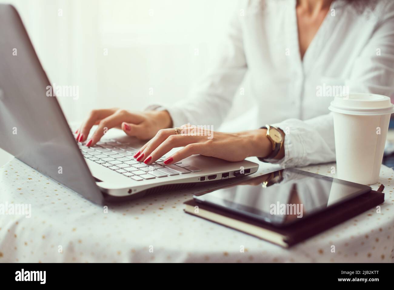 Woman biting computer keyboard in hi-res stock photography and images ...