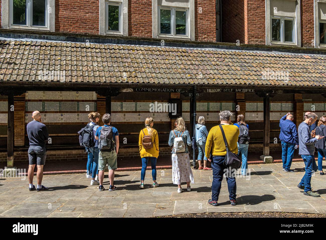 People at Postman's Park a shady garden in the City Of London , home to ...