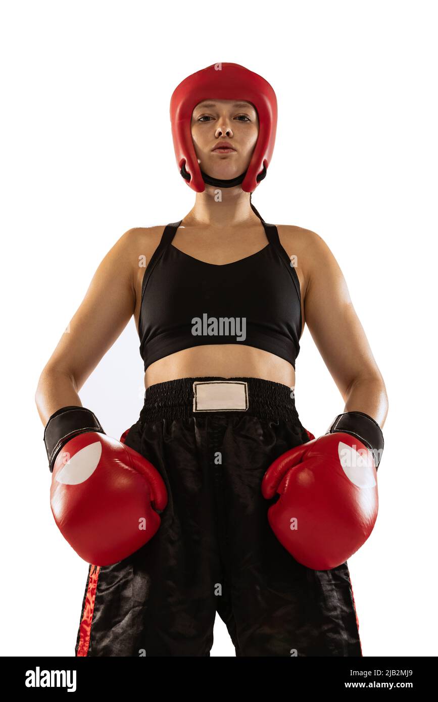 Portrait of professional female boxer in sports protective equipment ...