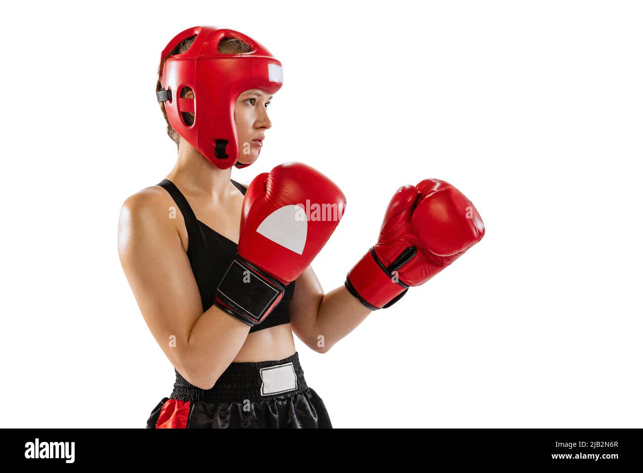 Portrait of professional female boxer in sports protective equipment ...