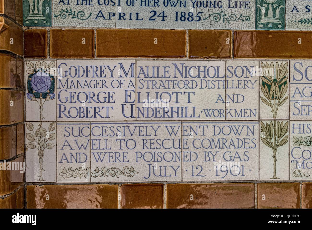 A ceramic memorial tablet dedicated to Godfrey Nicholson on the wall at ...