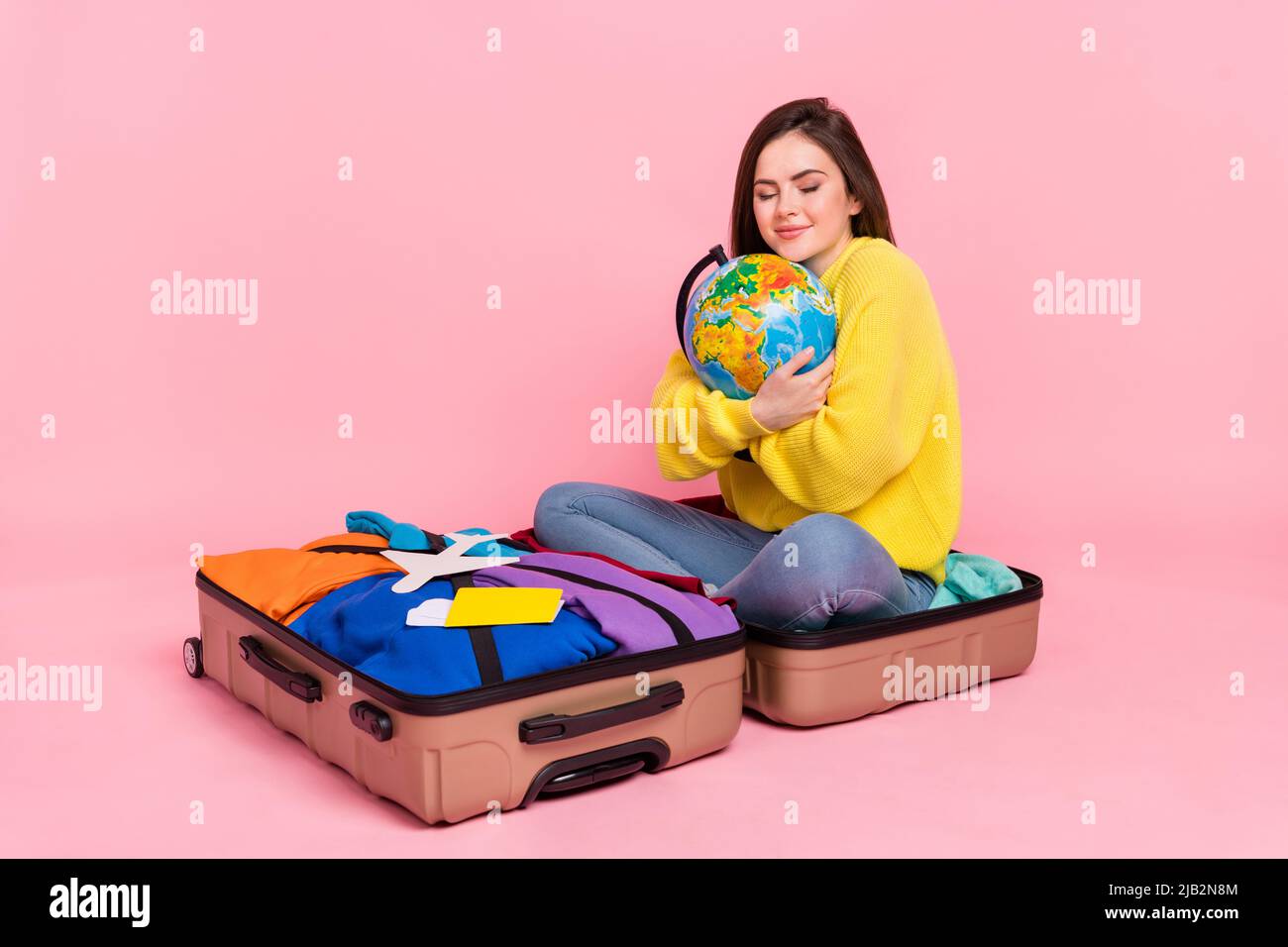 Full length photo of young girl dreamy hold globe trip around world ...