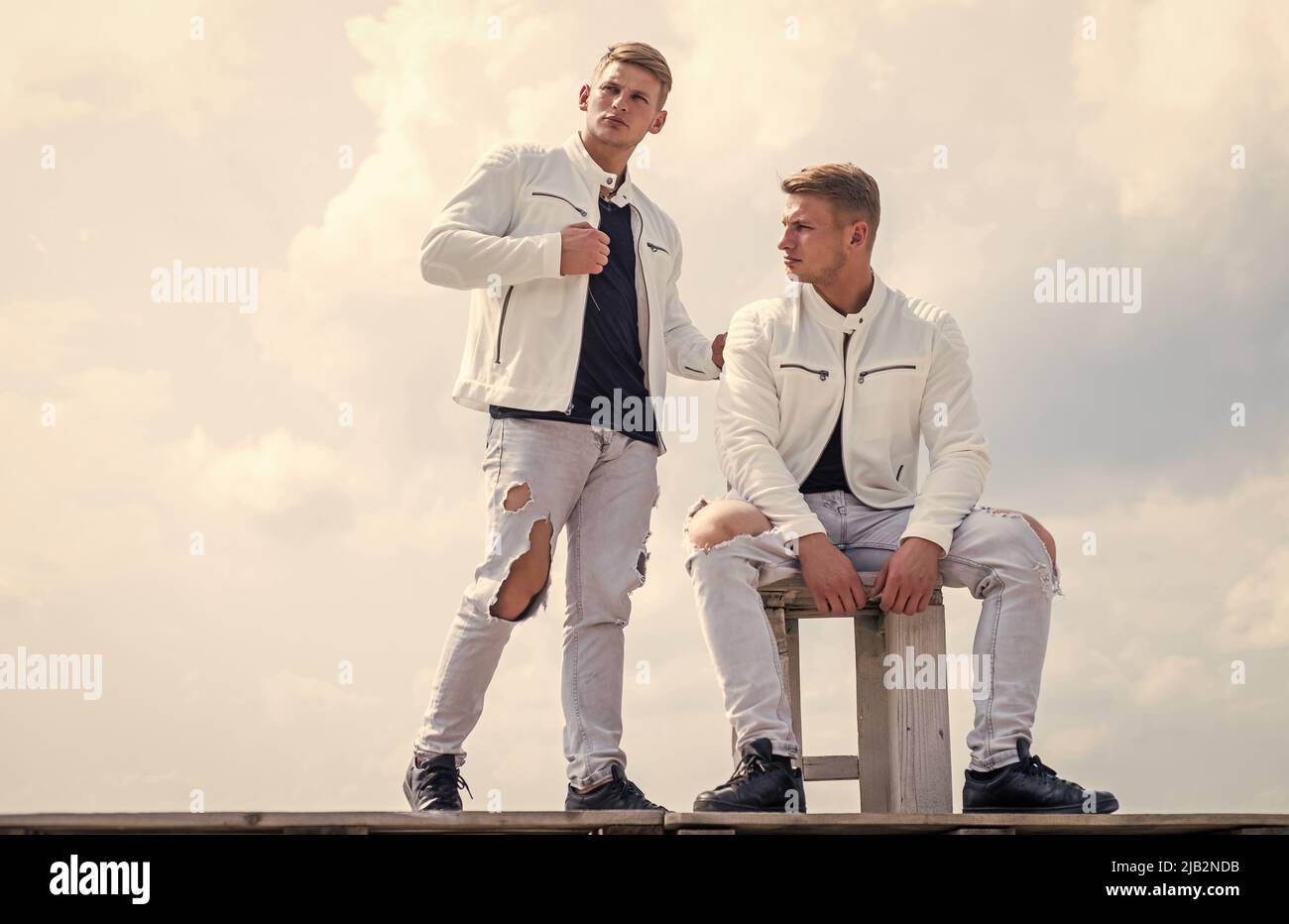 twin brothers men in white casual clothes look alike, male beauty Stock ...