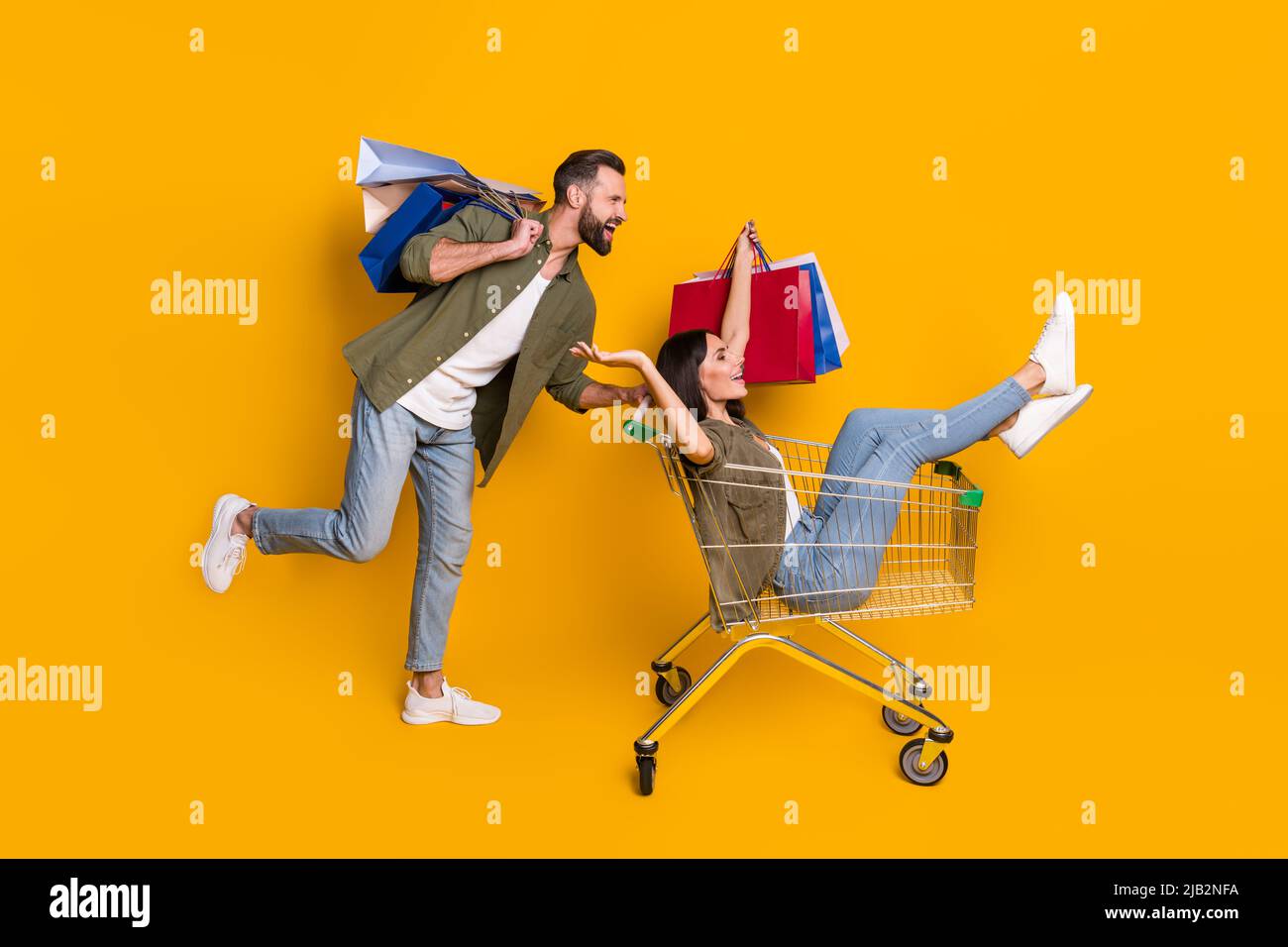 Full size profile side photo of young girl guy fast rush shopping ...