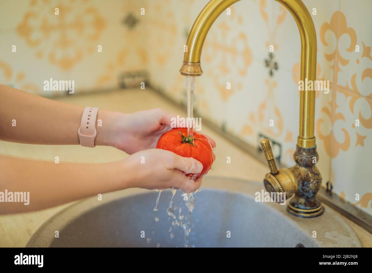 Washing tomato in running water hi-res stock photography and images - Alamy