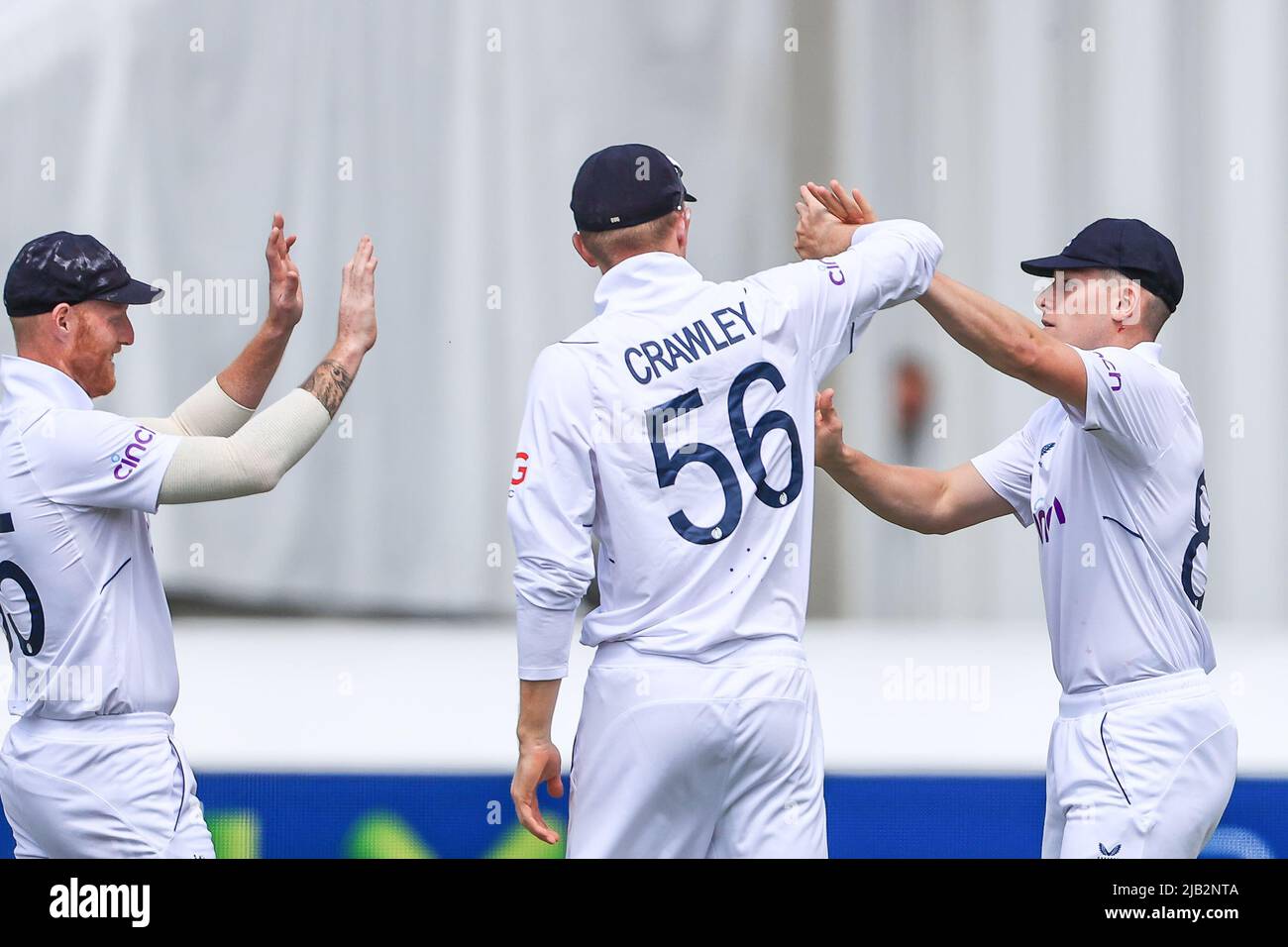 Matthew Potts of England celebrates his catch with Zak Crawley Stock ...