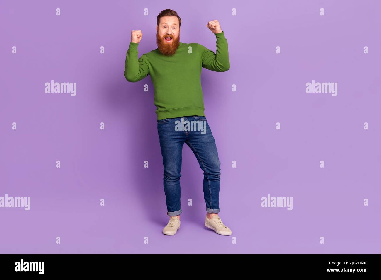 Full body photo of satisfied delighted man raise fists celebrate ...