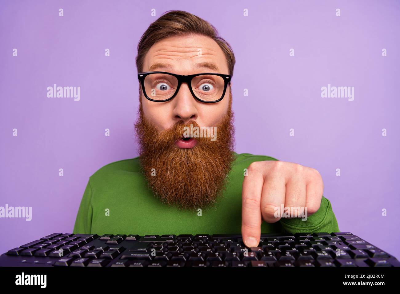 Portrait of attractive freelancer man press button on keyboard ...