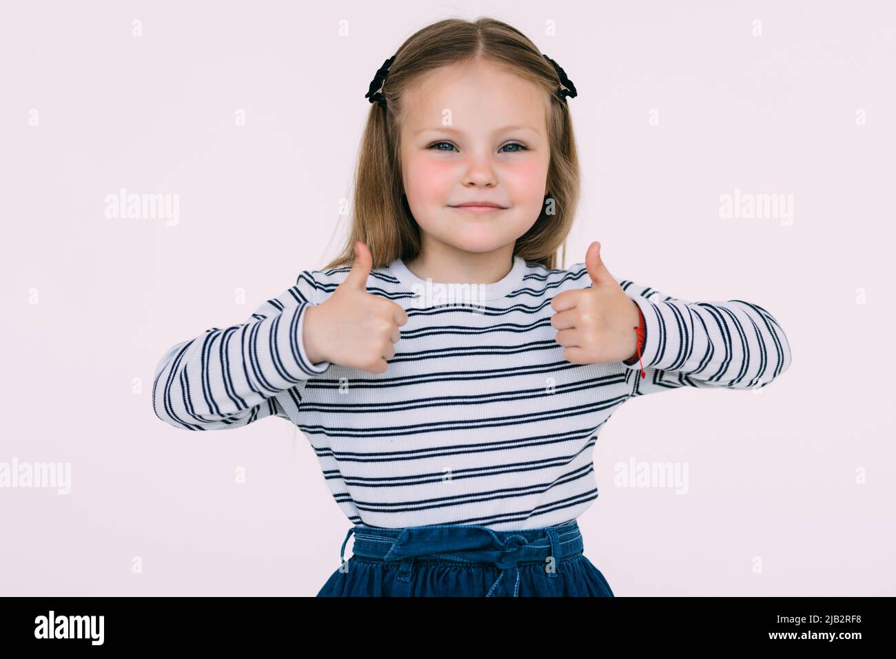 kid giving two thumbs up Stock Photo - Alamy