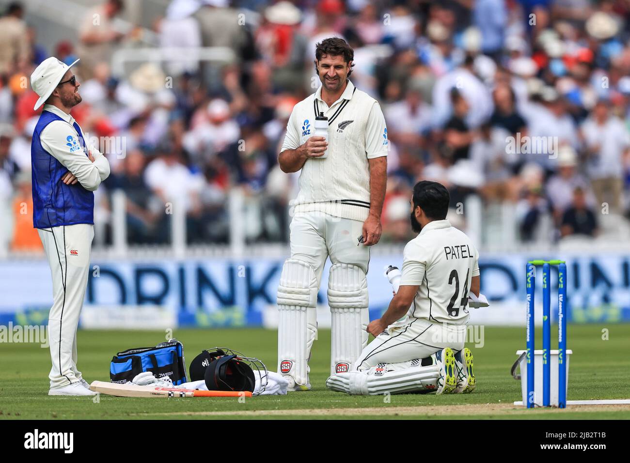 Colin De Grandhomme and Ajaz Patel of New Zealand chat during a break ...