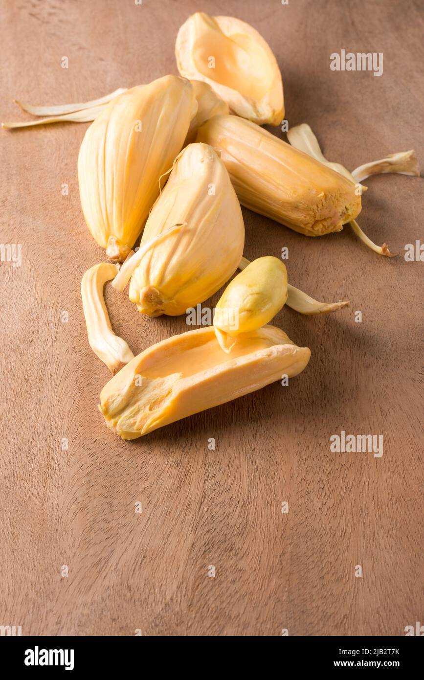 jackfruit flesh with seeds on a wooden surface, tropical health ...