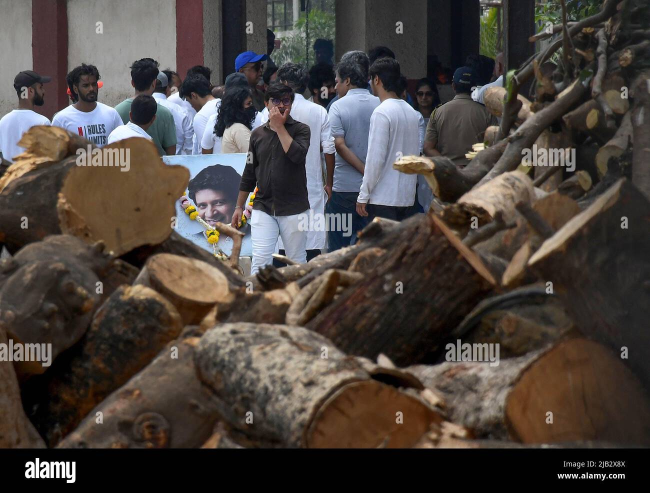 People are seen inside a crematorium during the funeral of Bollywood ...