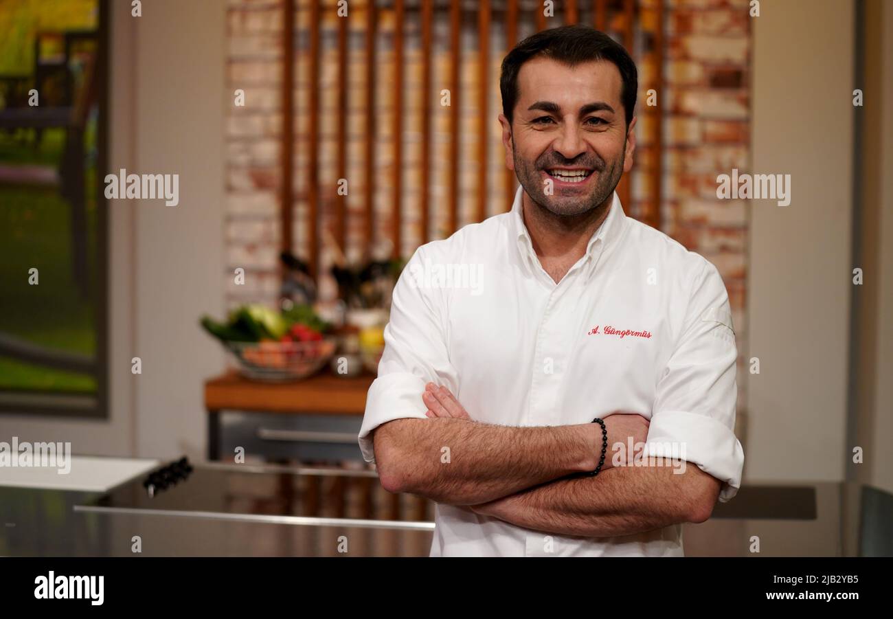 07 January 2022, Hamburg: Star chef Ali Güngörmüs stands in the studio ...