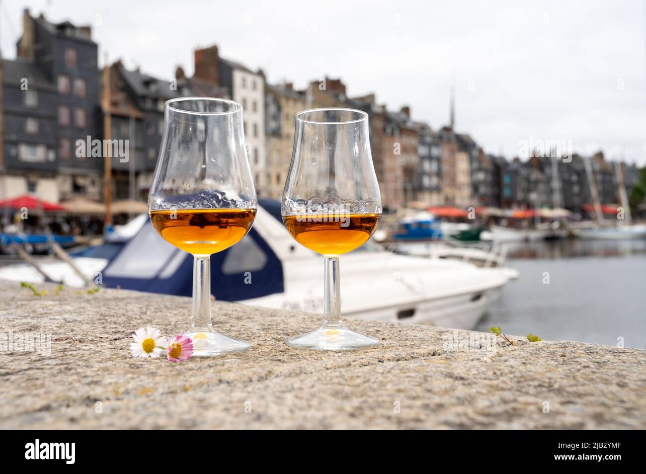 Tasting of apple calvados drink from glasses in old Honfleur harbour ...