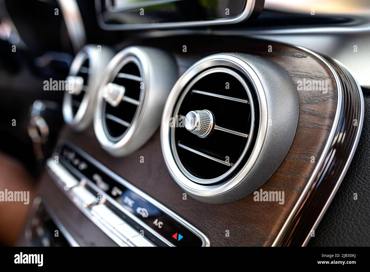 The interior of a modern passenger car with three vents visible and air ...