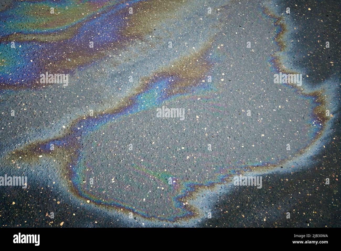 Multi-colored oil stain on the pavement Stock Photo - Alamy