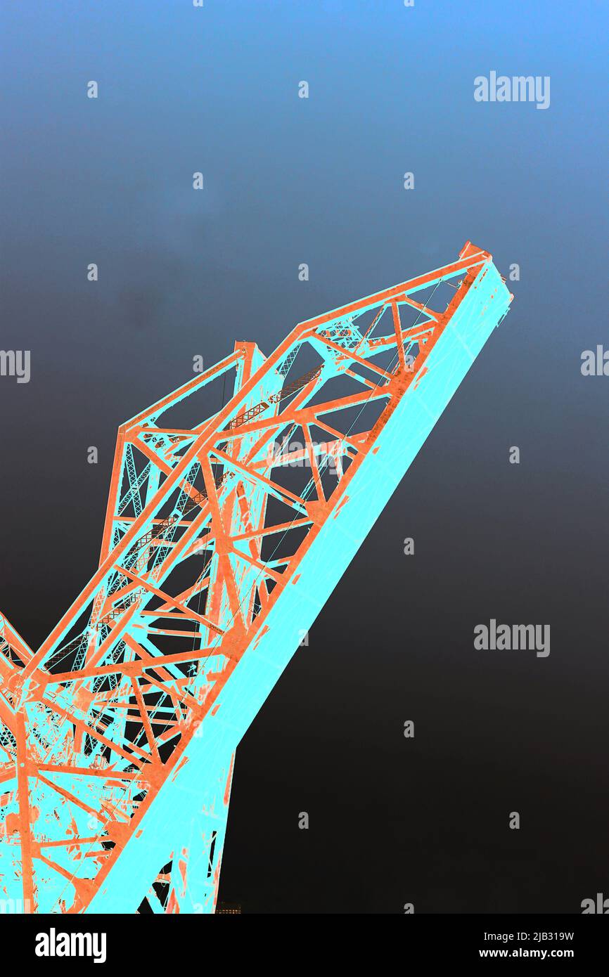 A very tall steel truss structure standing in the industrial district ...