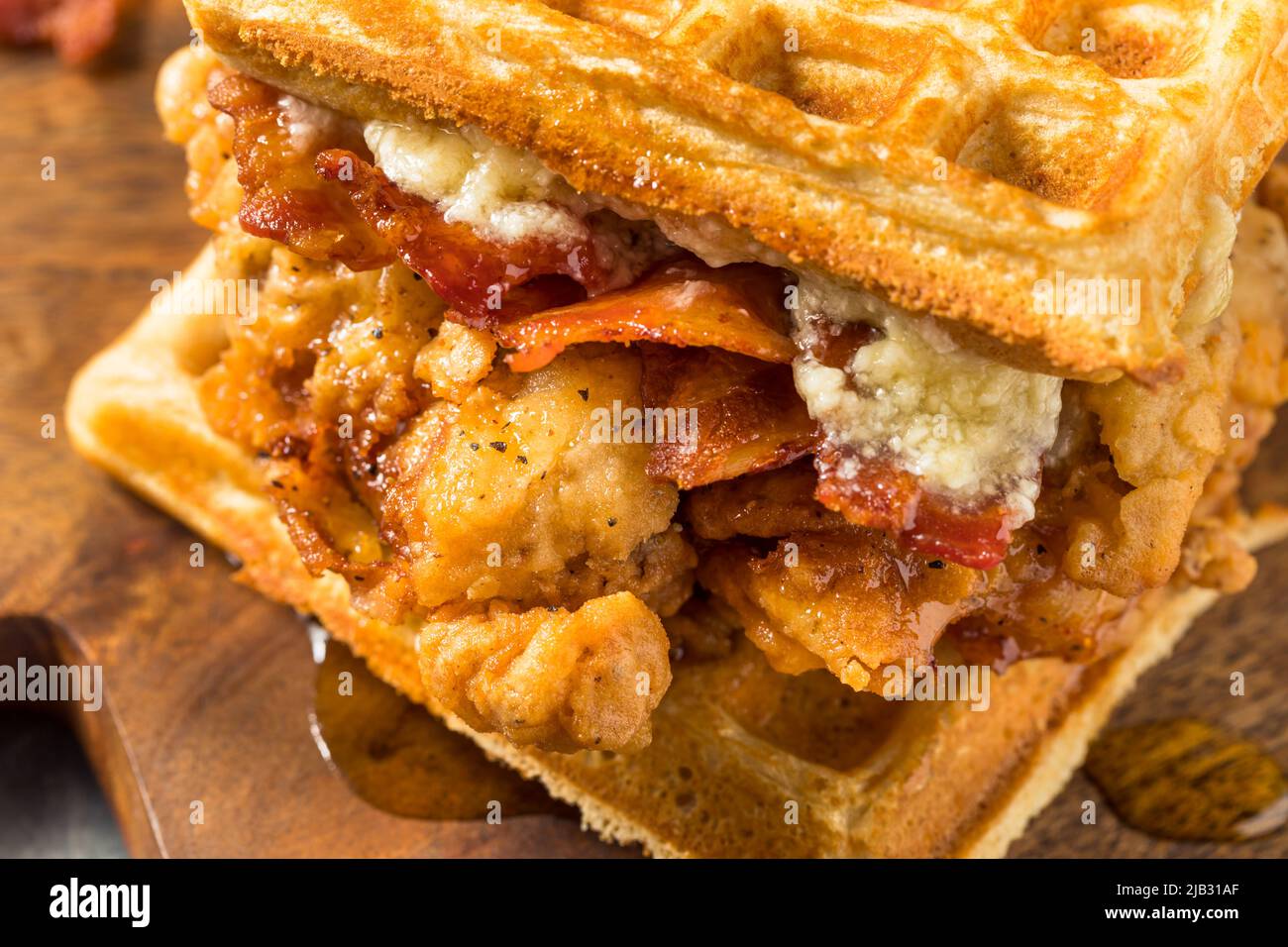 Homemade Chicken and Waffle Sandwich with Bacon and Syrup Stock Photo ...