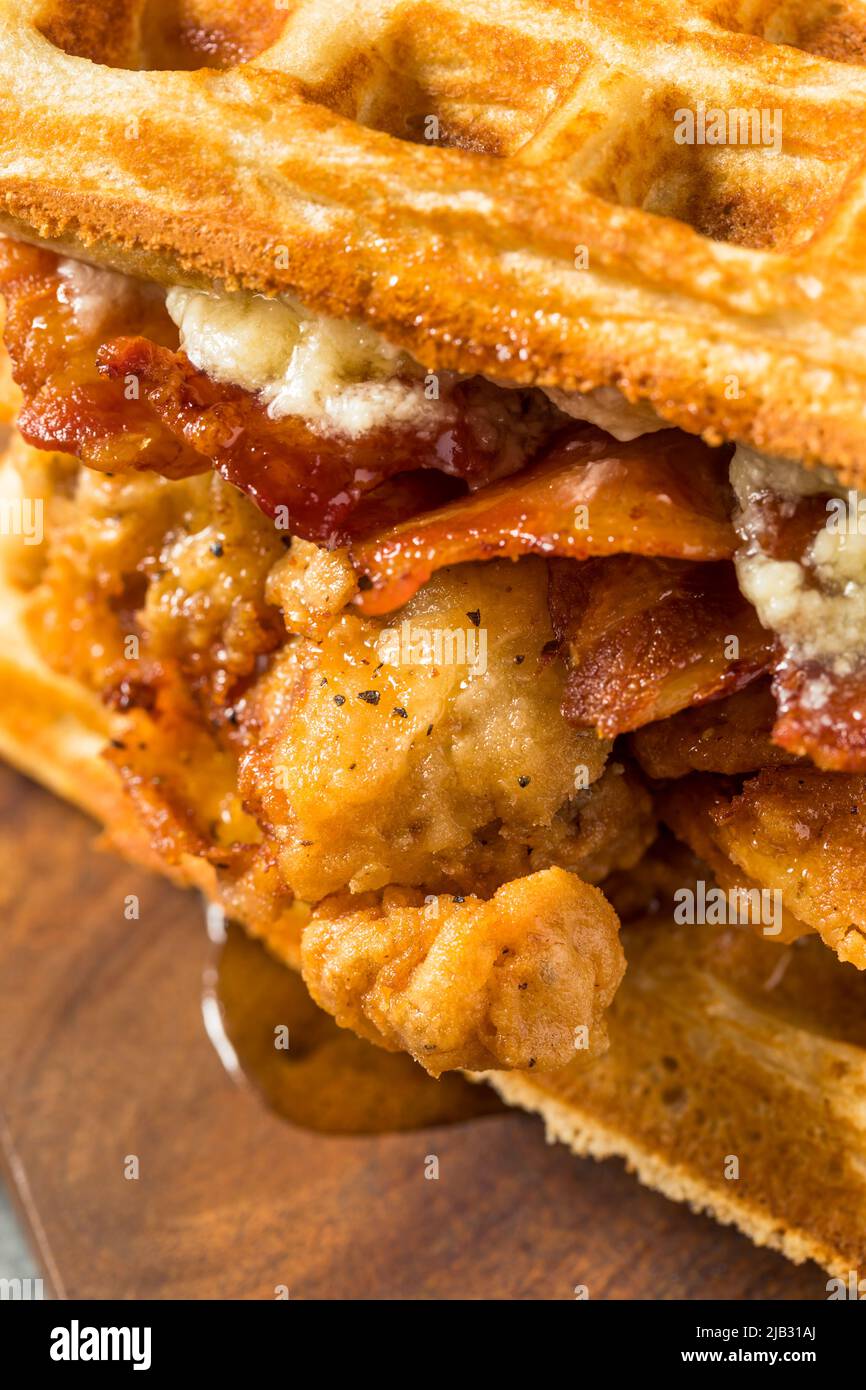 Homemade Chicken and Waffle Sandwich with Bacon and Syrup Stock Photo ...