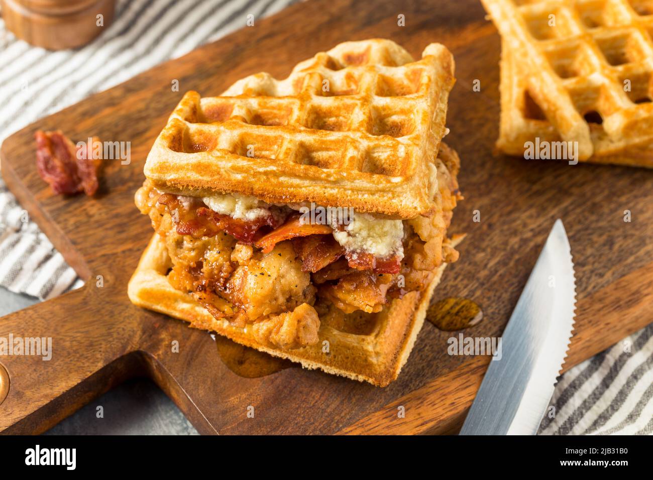 Homemade Chicken and Waffle Sandwich with Bacon and Syrup Stock Photo ...
