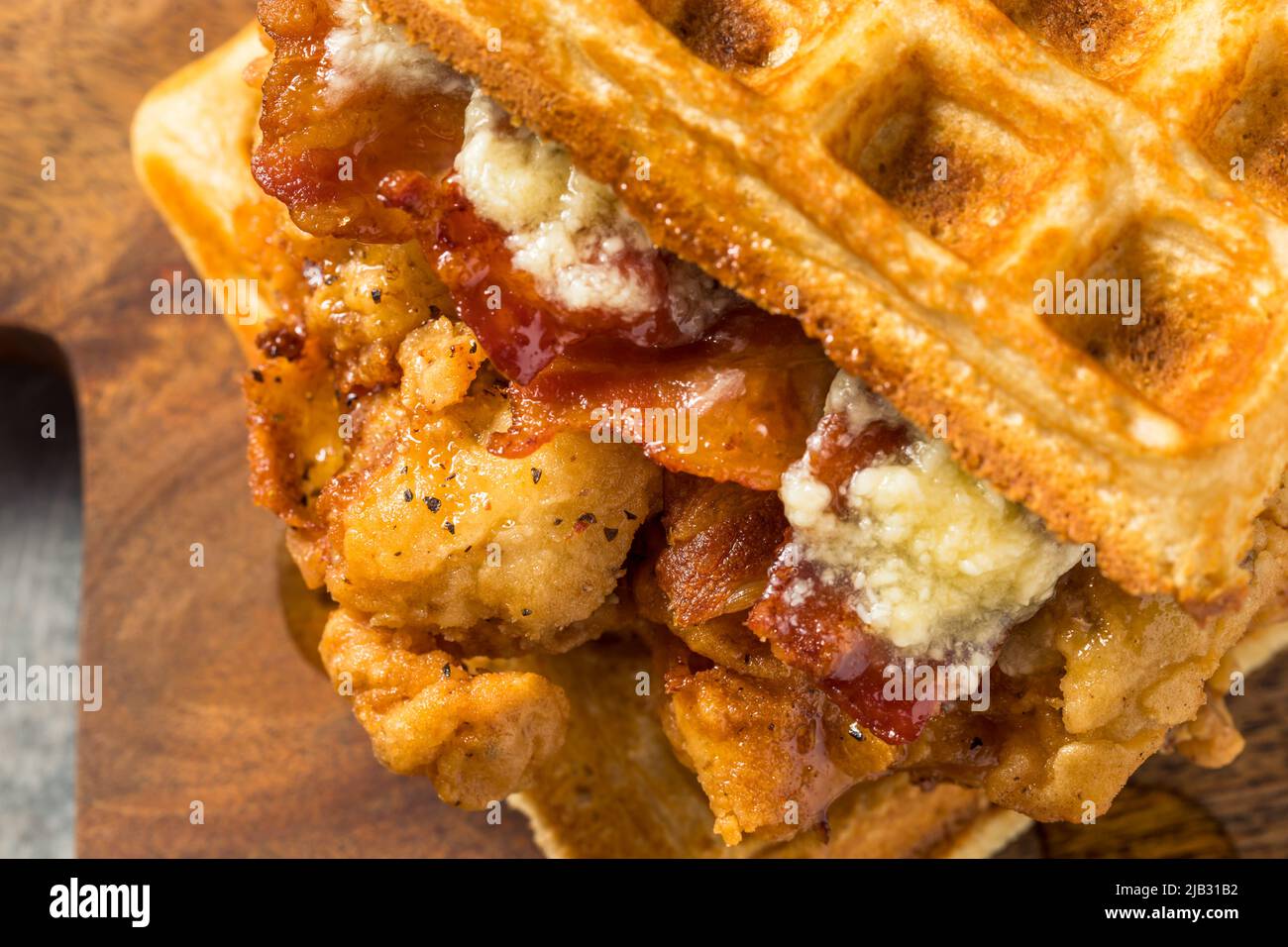 Homemade Chicken and Waffle Sandwich with Bacon and Syrup Stock Photo ...