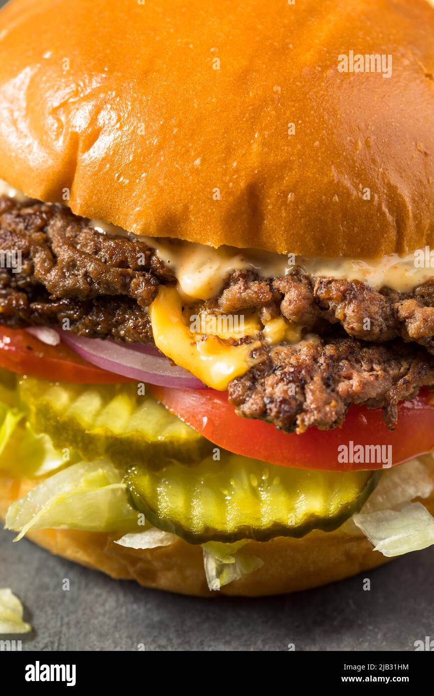 Homemade Cheese Smash Burger with Fries Pickles and Tomatoes Stock ...