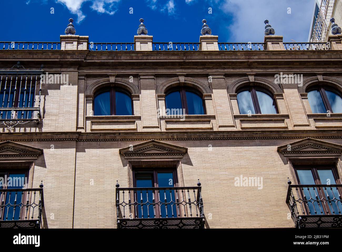 Seville, Spain - June 01, 2022 Facade of a building in the streets of ...