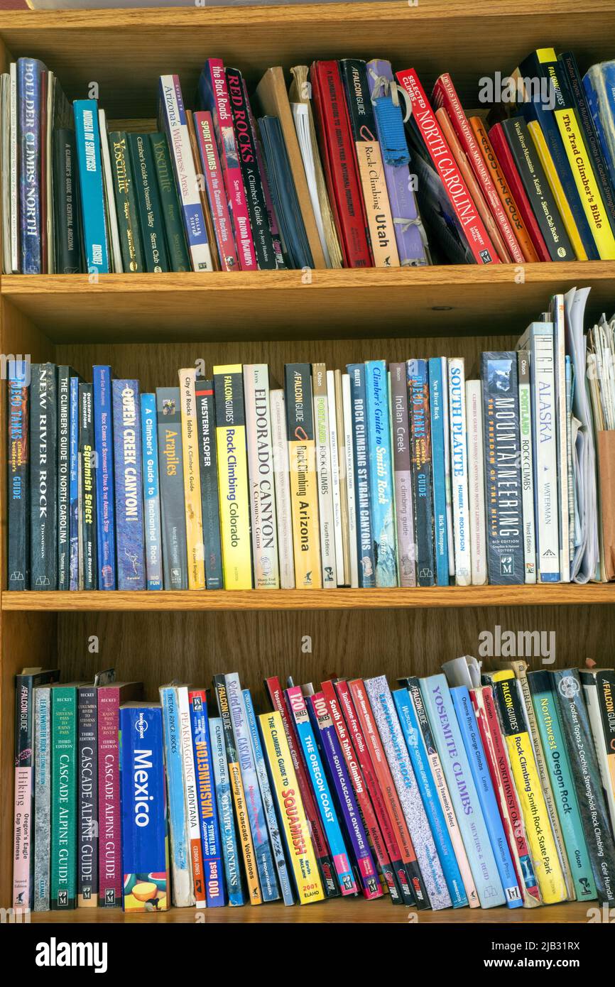 Travel guide books collection on bookcase at home. Portland, Oregon ...