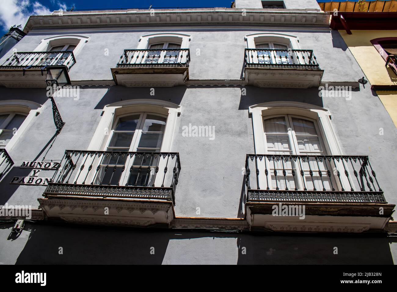 Seville, Spain - June 01, 2022 Facade of a building in the streets of ...