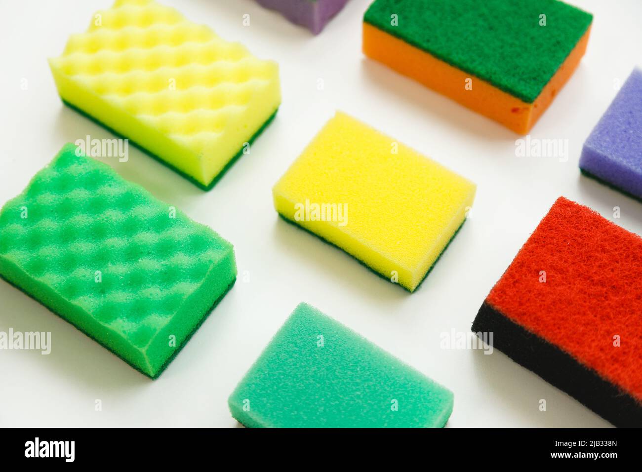 colored kitchen sponges isolated on white background Stock Photo - Alamy