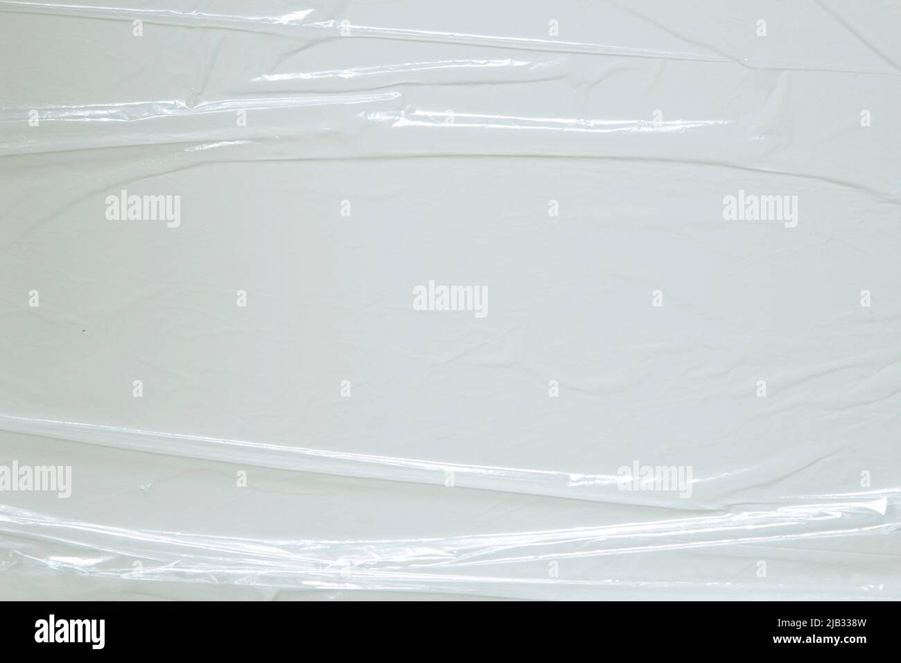 Wrinkled plastic wrap on white color background. Crumpled transparent ...