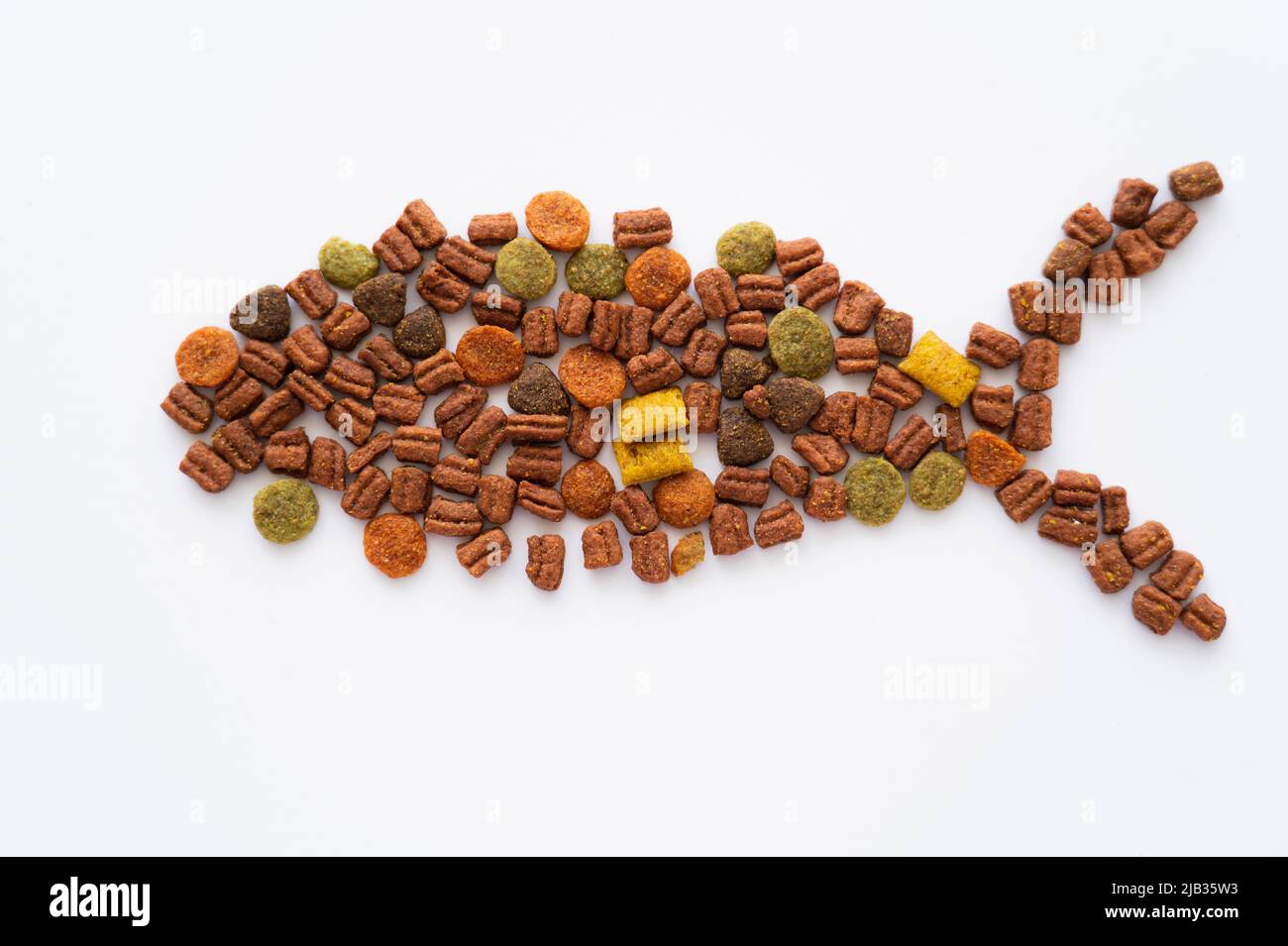 shape of fish made with dry pet food isolated on white Stock Photo - Alamy