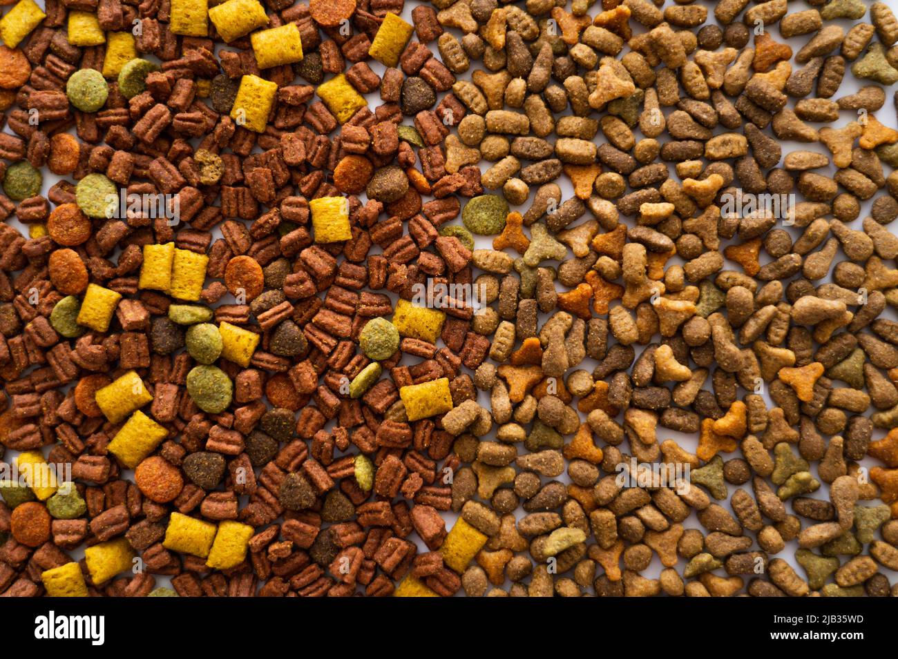 top view of dry pet food in different shapes as background Stock Photo ...