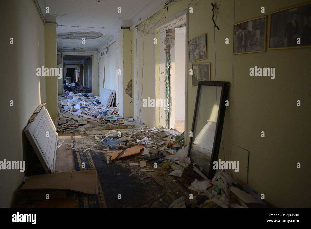 Rubble covers the floor in a corridor inside the Kharkiv Regional State Administration building ...