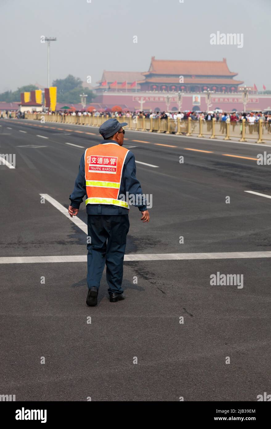 Traffic Warden patrols the Guangchang West Side Road by Tiananmen ...