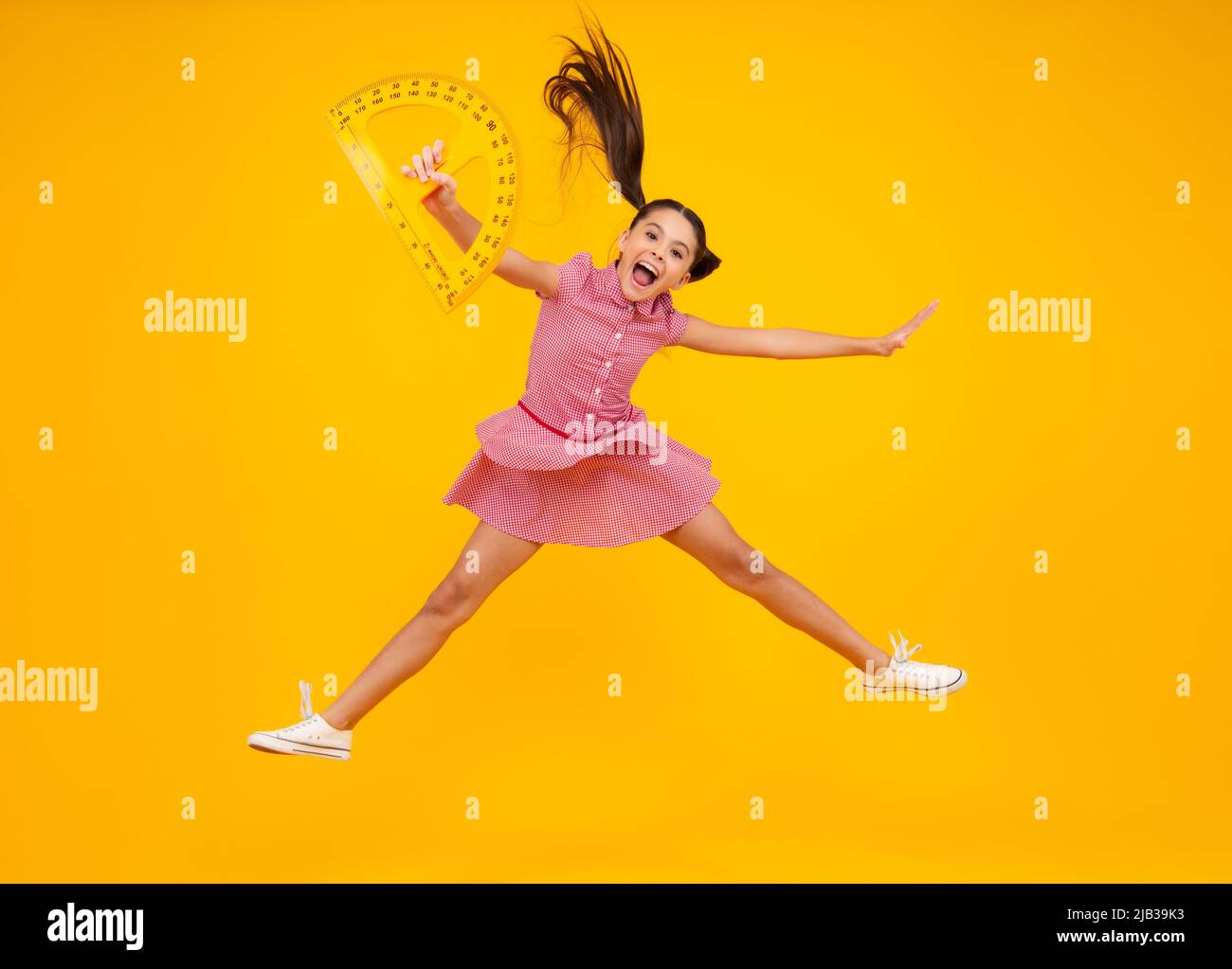 Amazed teenager. Teenager school girl study math or geometry lesson ...